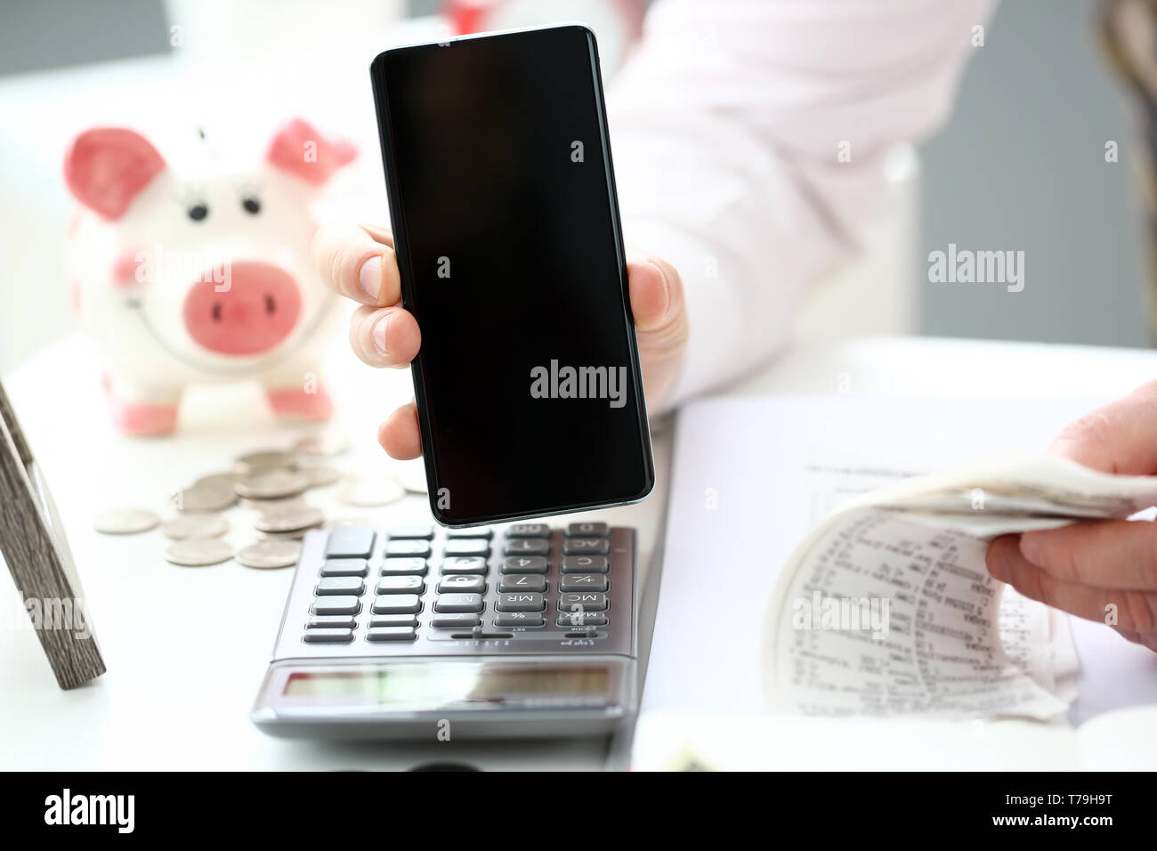 Male hand showing cell phone to camera to show something very important ...