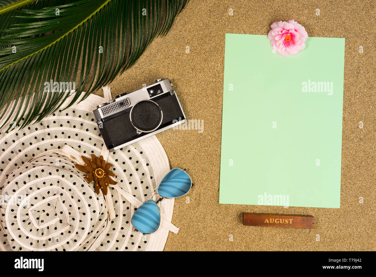 space for text, photo frame, beach theme on sand background, top view ...