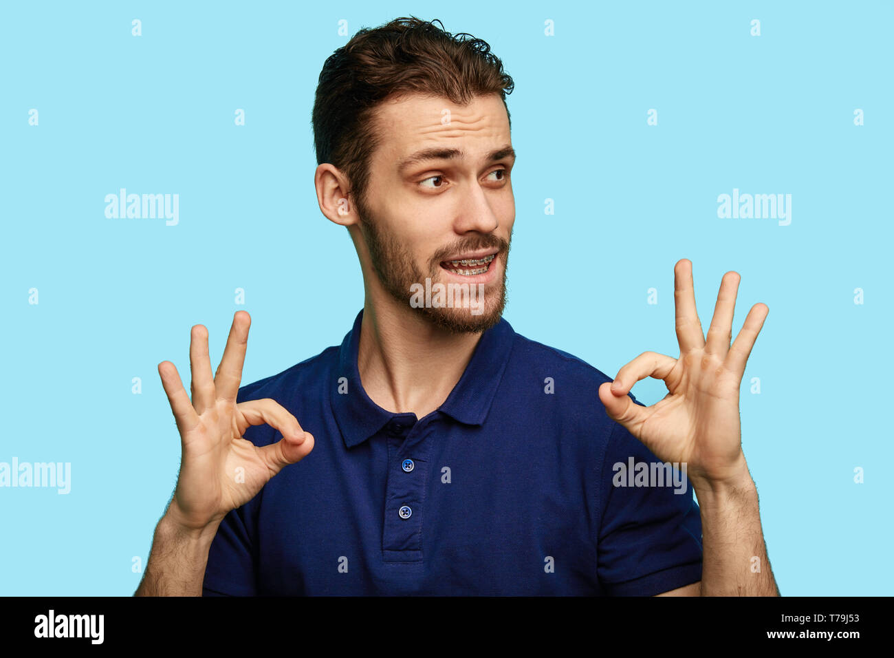 funny attractive man showing ring sign. cute connecting the thumb and ...