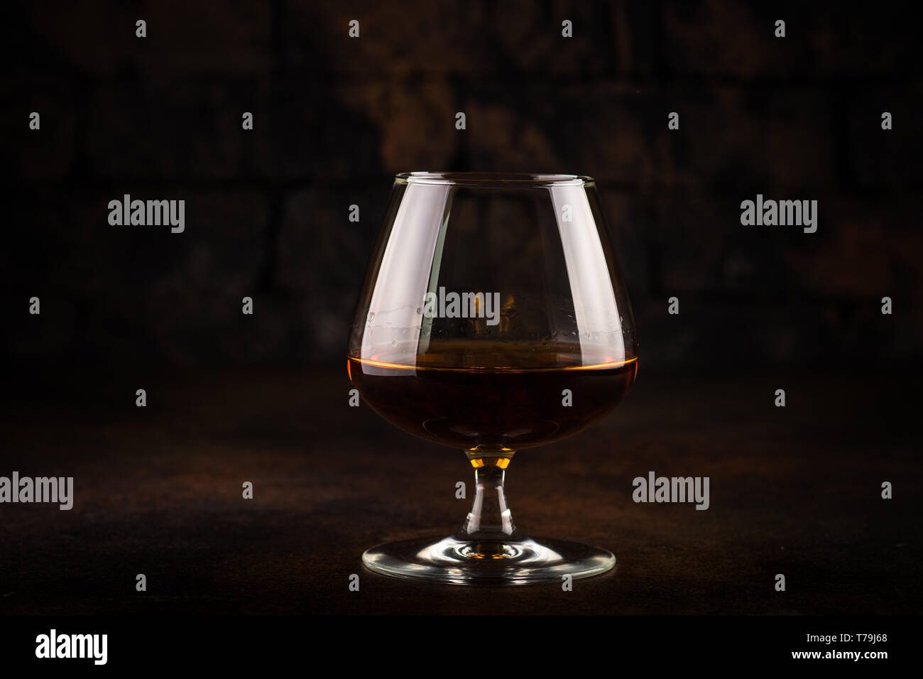 Cognac or brandy in the glass Stock Photo - Alamy