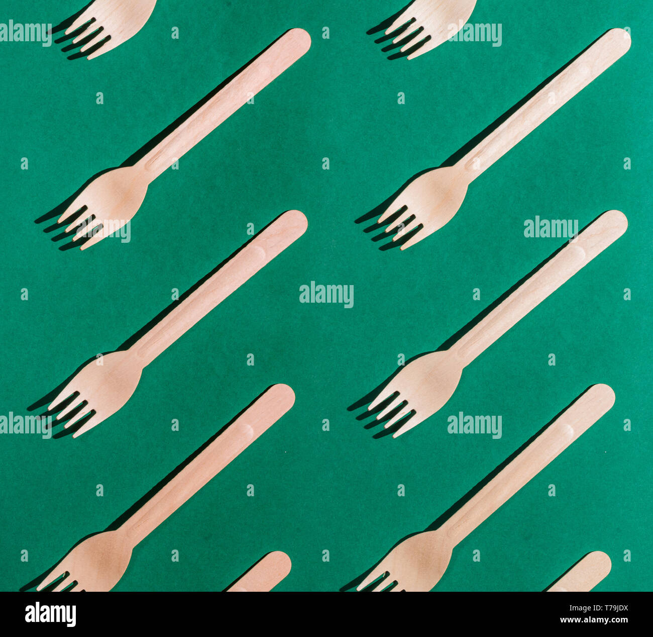 forks isolated on yellow background, top view , table setting concept ...