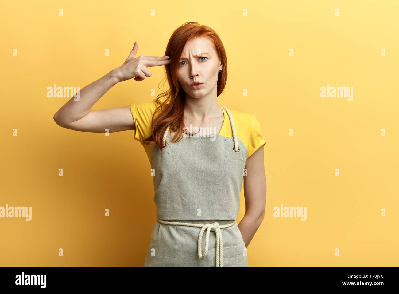 Woman pointing finger head gun hi-res stock photography and images - Alamy