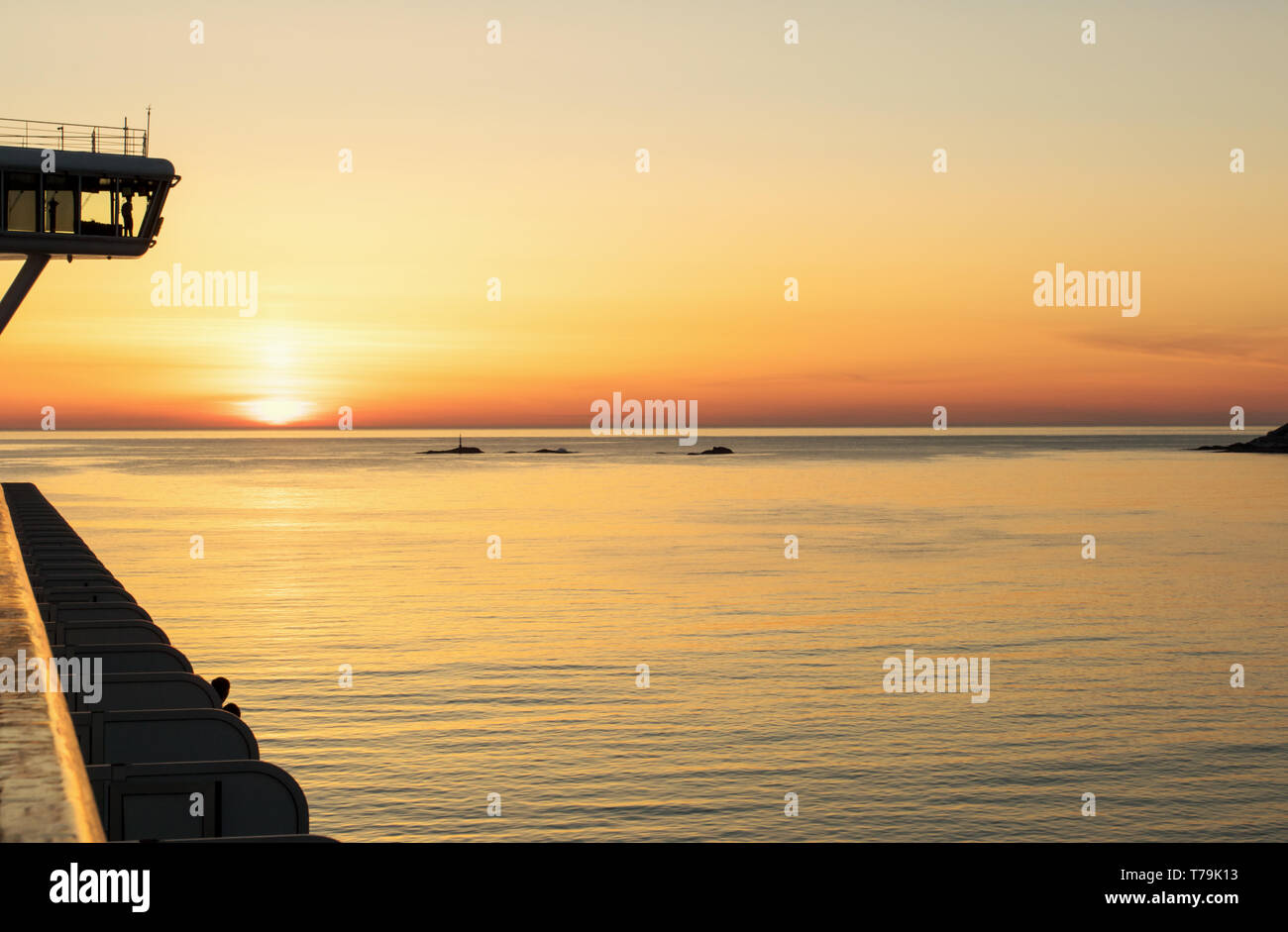 On the balcony of a cruise ship sailing off into the sunset with a ...