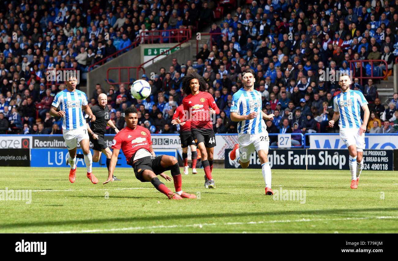 Manchester United's Marcus Rashford slips as he shoots at goal during ...