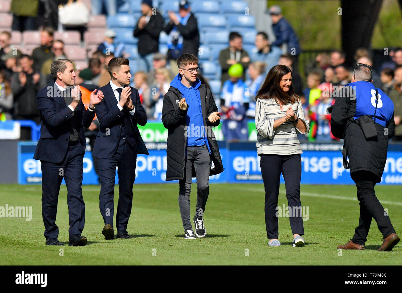Huddersfield Town Chairman Dean Hoyle (left) salutes the fans after his ...
