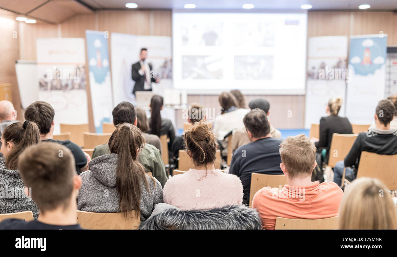 Man giving presentation in lecture hall at university Stock Photo - Alamy