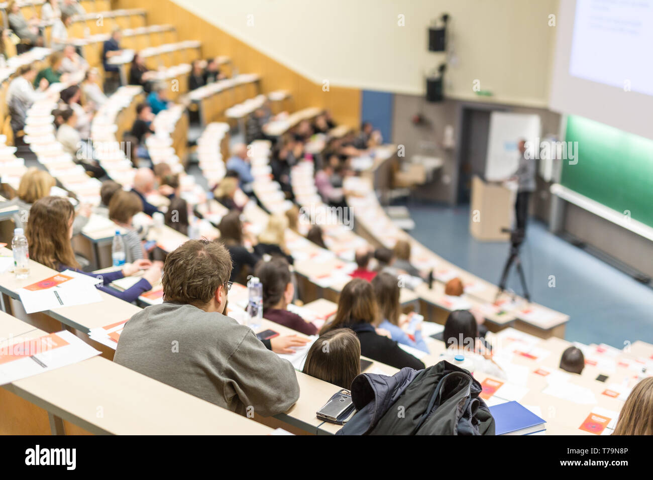 Expert speaker giving a talk at scientific business conference event ...