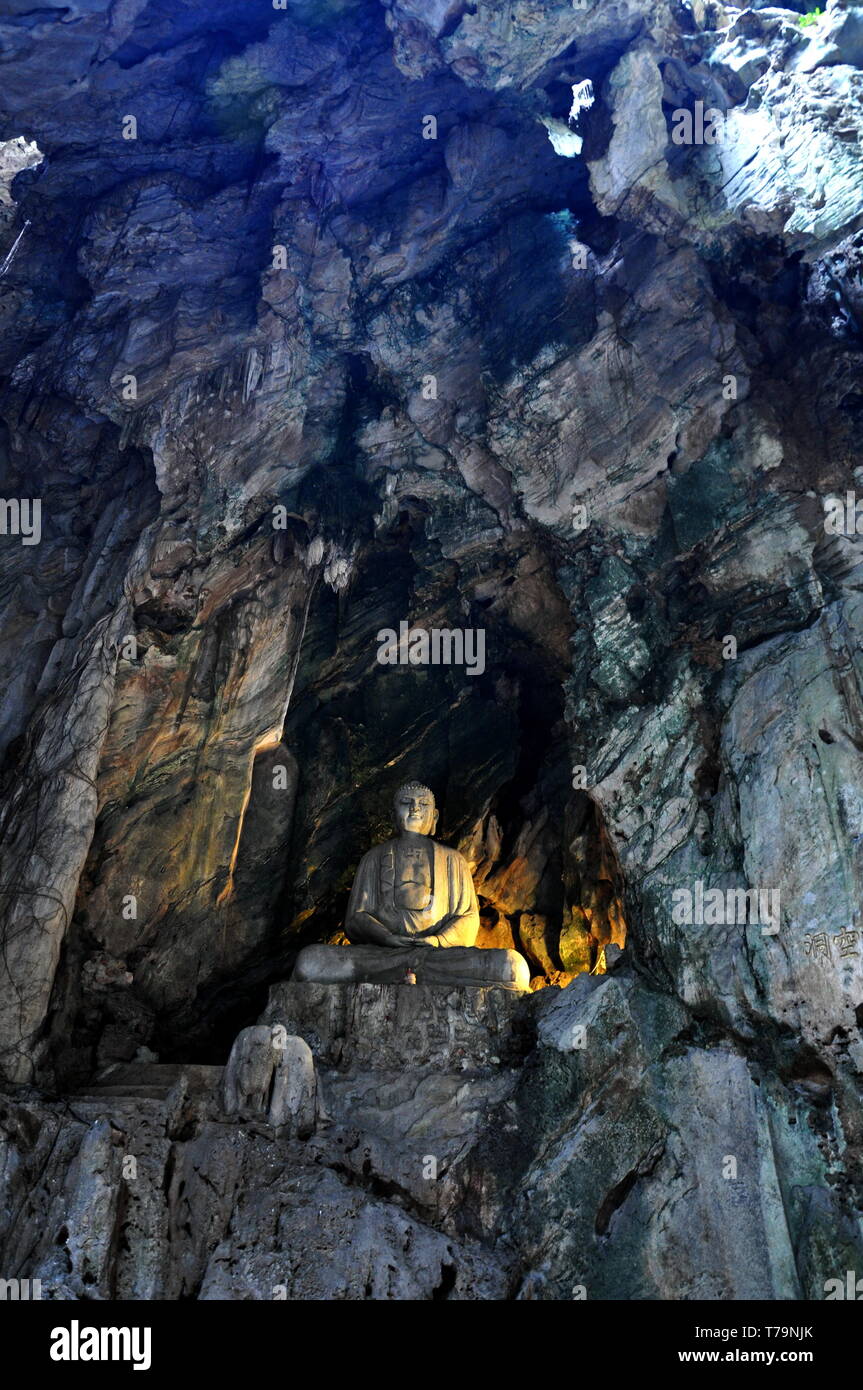 The buddha statue in the cave Stock Photo - Alamy