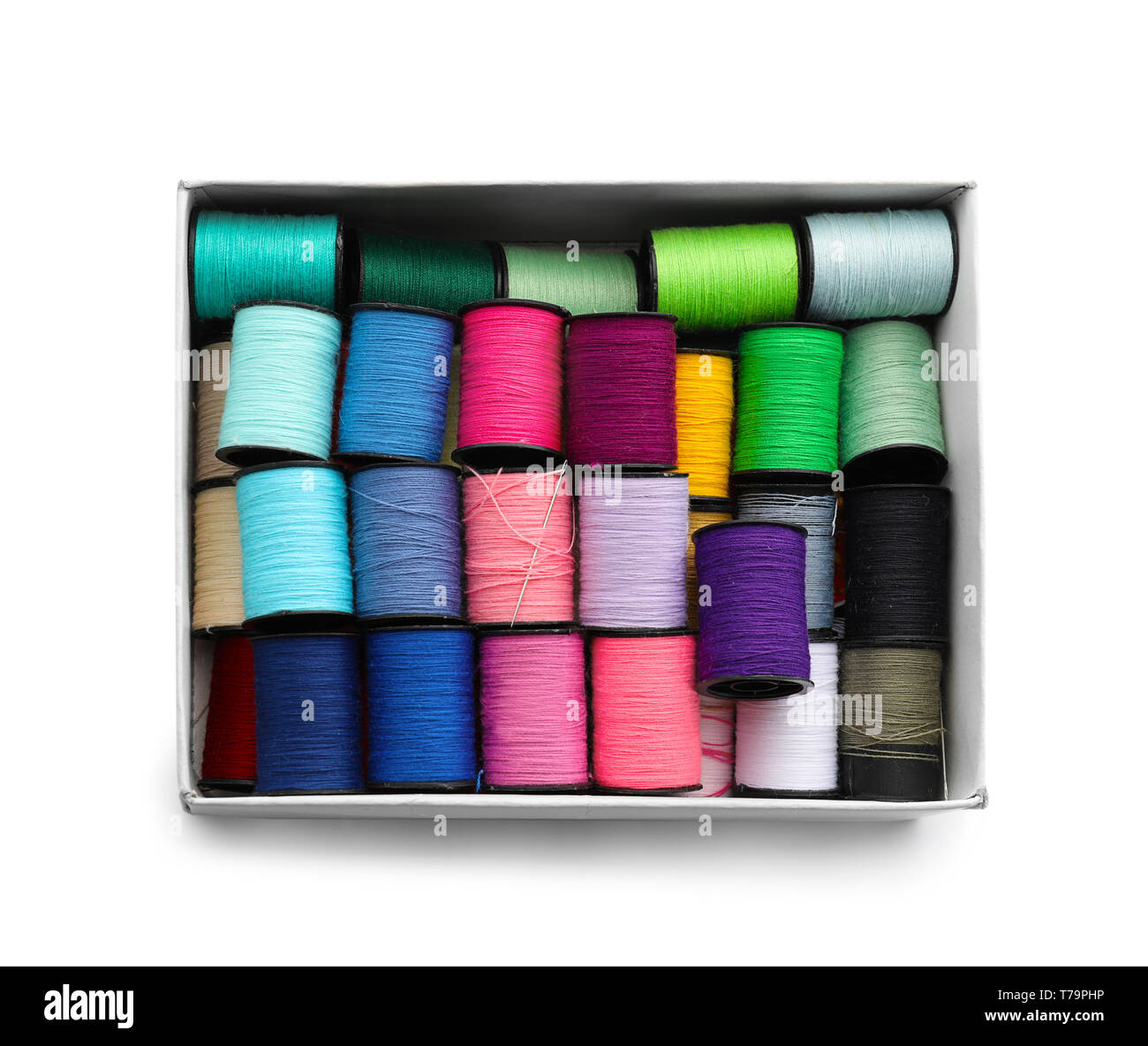 Box with colorful sewing threads on white background Stock Photo - Alamy