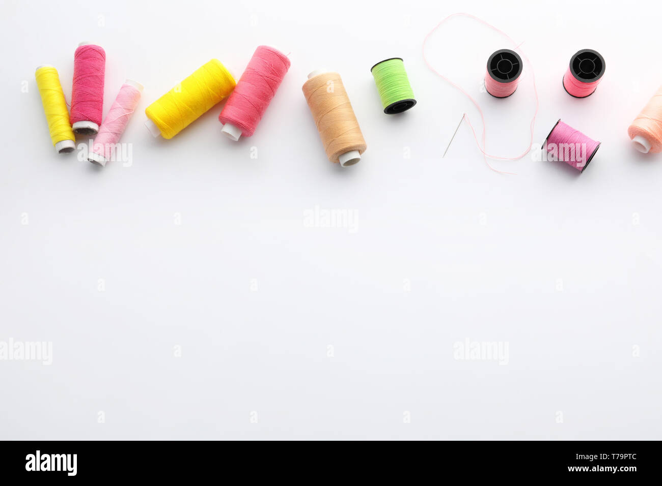 Set of sewing threads on white background Stock Photo - Alamy