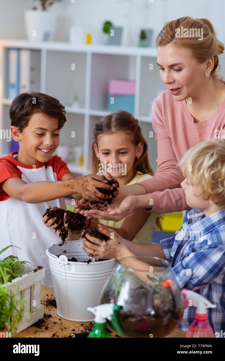 Nice botany lesson. Boys and girl attending botany lesson feeling ...