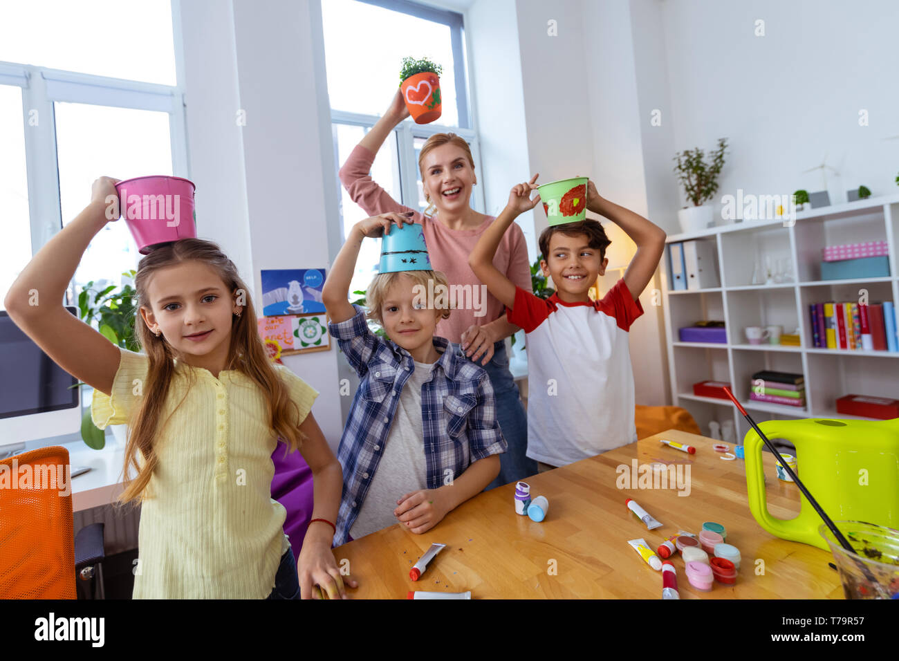 Pupils showing buckets. Primary school pupils showing their colorful ...