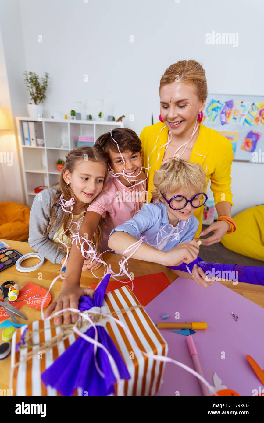 Happy and joyful. Funny pupils feeling happy and joyful after amazing ...