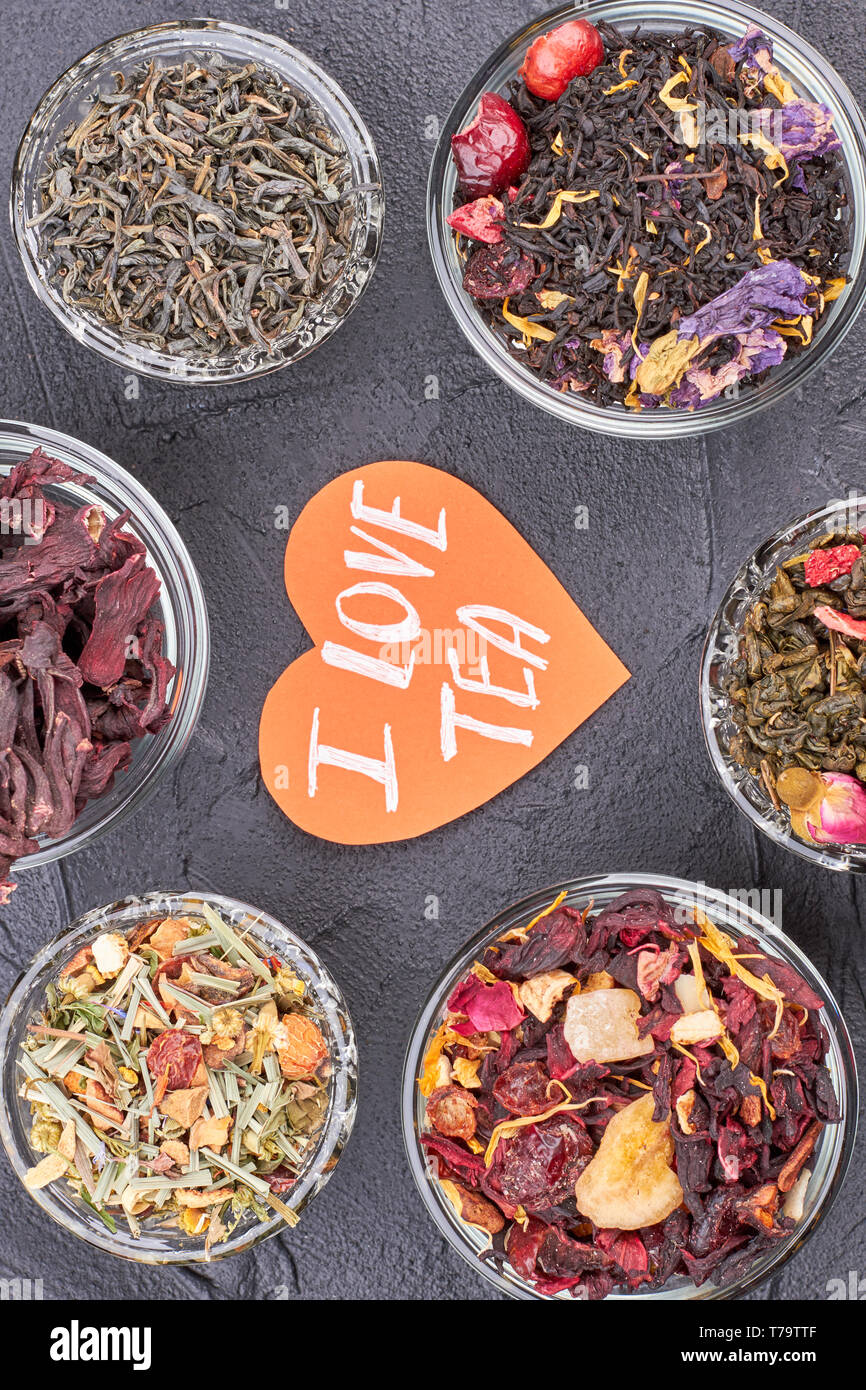 Background of dried tea leaves in bowls. Assortment of dry healthy teas ...