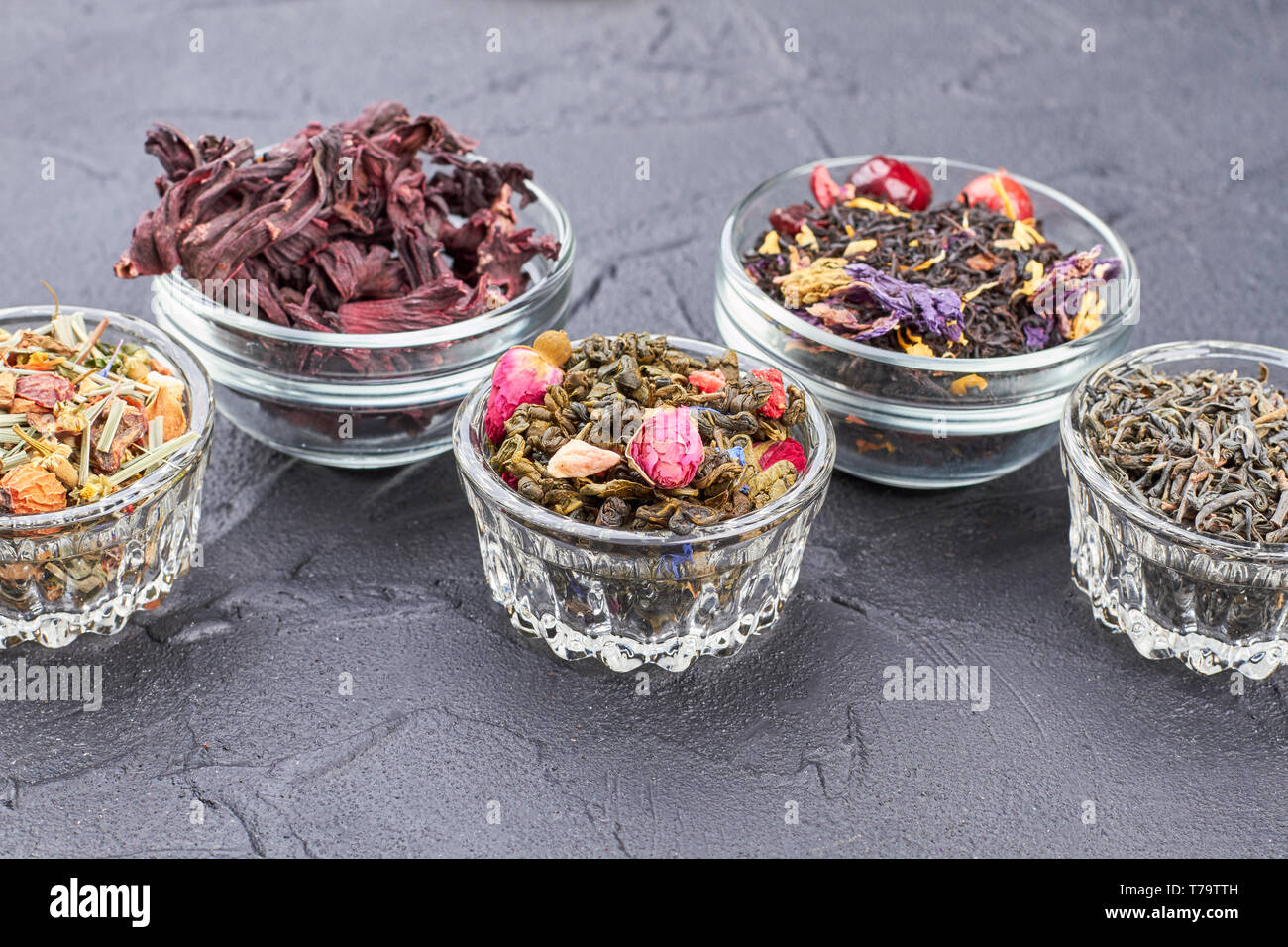 Group of glass bowls with assorted dried teas. Chinese tea culture ...