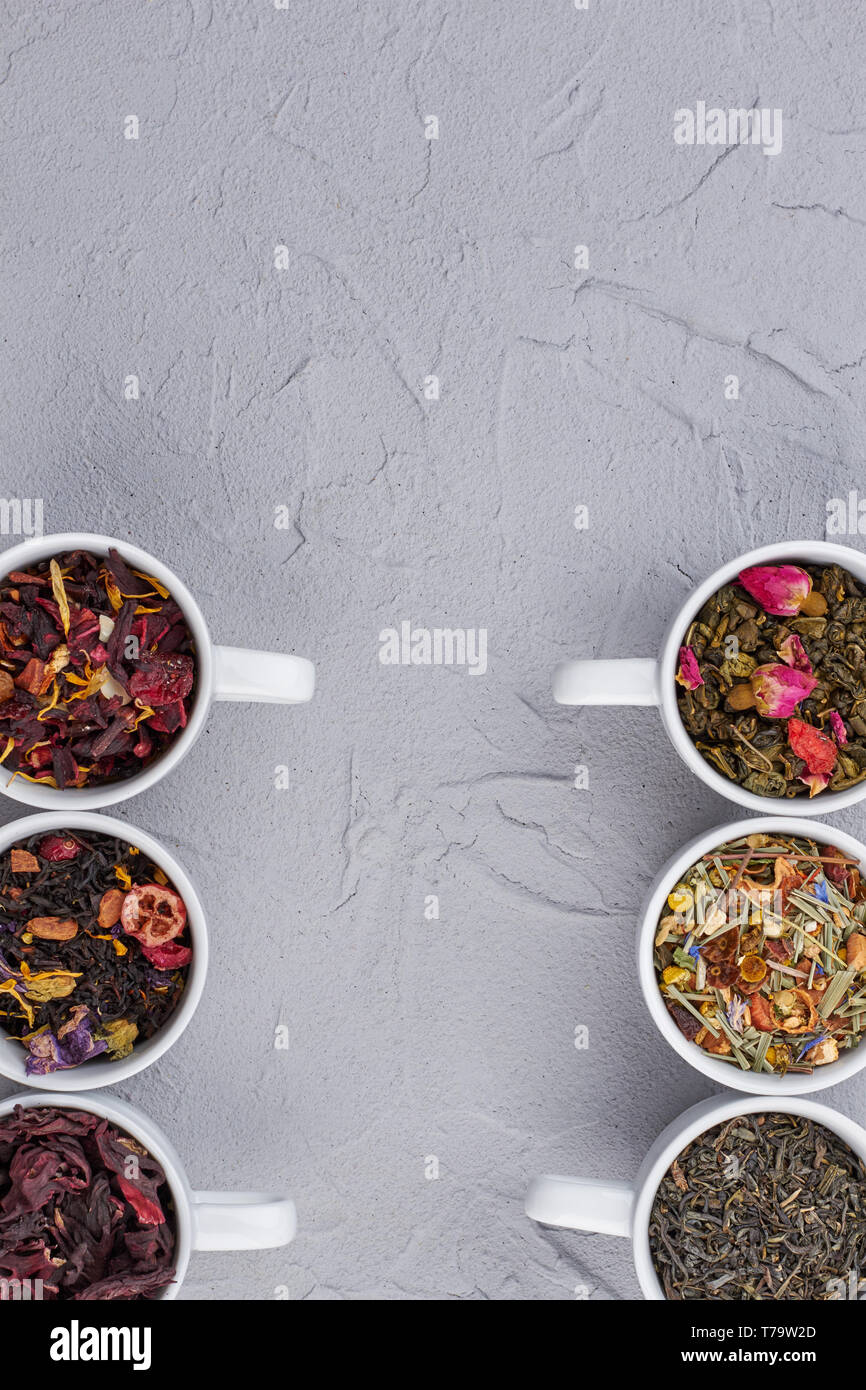 Assorted dry tea in cups and copy space. Different types of dry tea ...