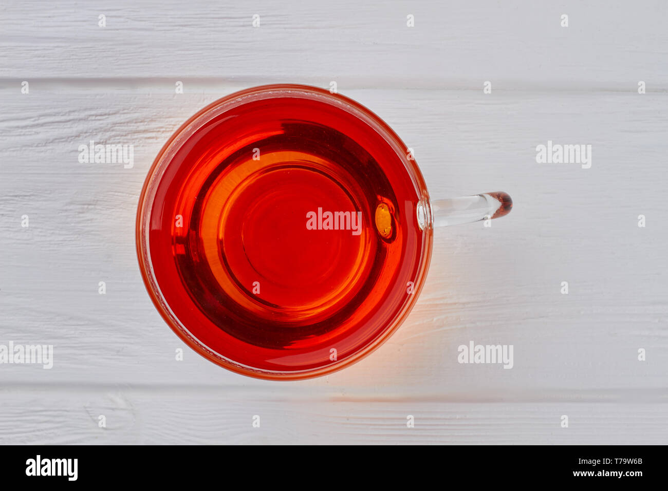 Glass cup with black tea, top view. Transparent mug of tea on white ...