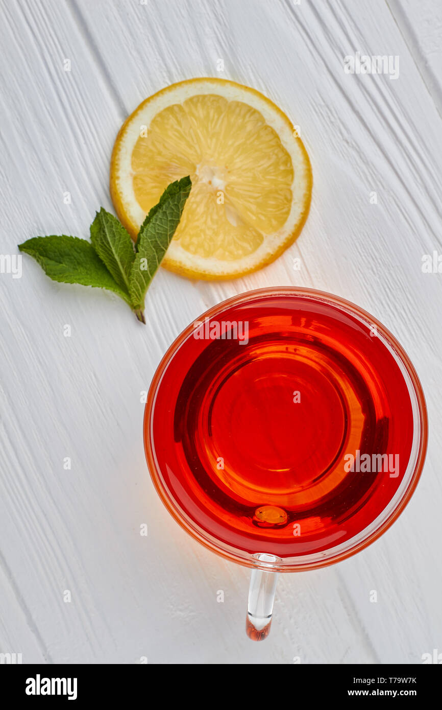 Cup of black tea, slice of lemon and mint. The benefits of drinking ...