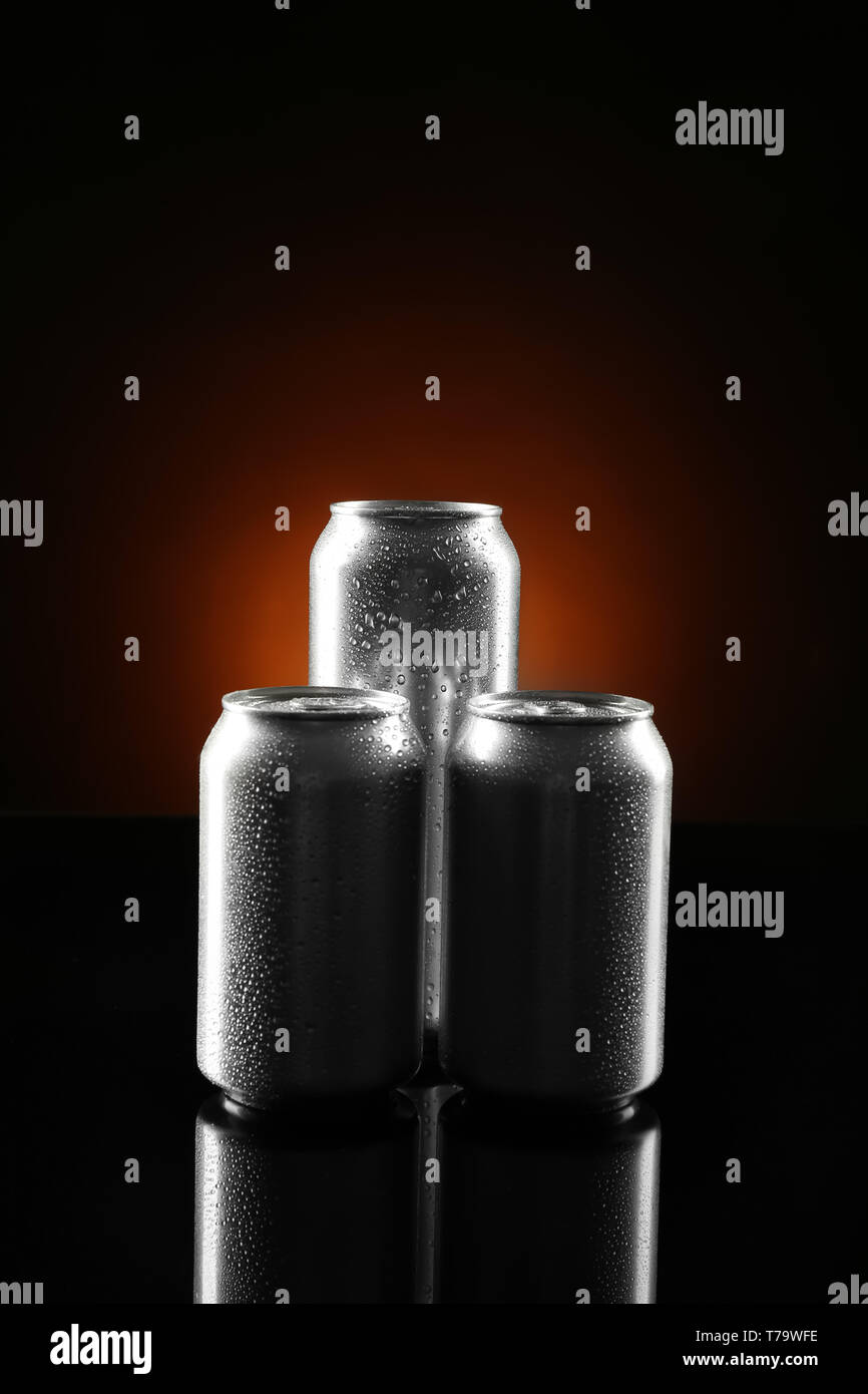 Fresh beer in aluminum cans on dark background Stock Photo - Alamy