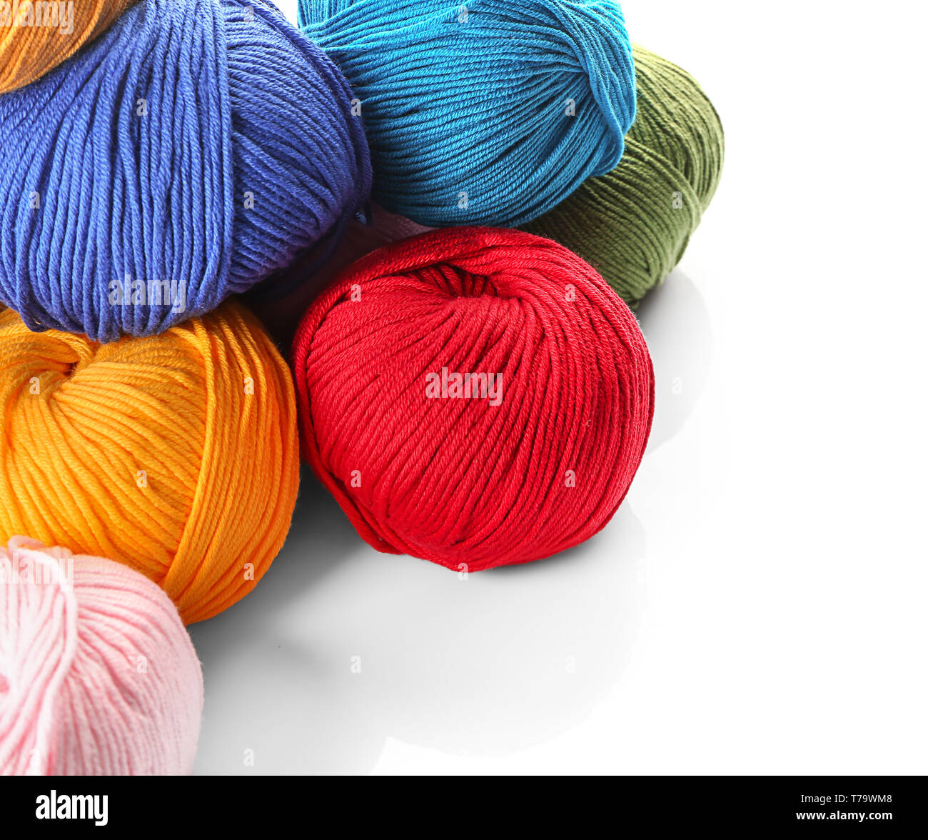 Colorful knitting yarn on white background Stock Photo - Alamy