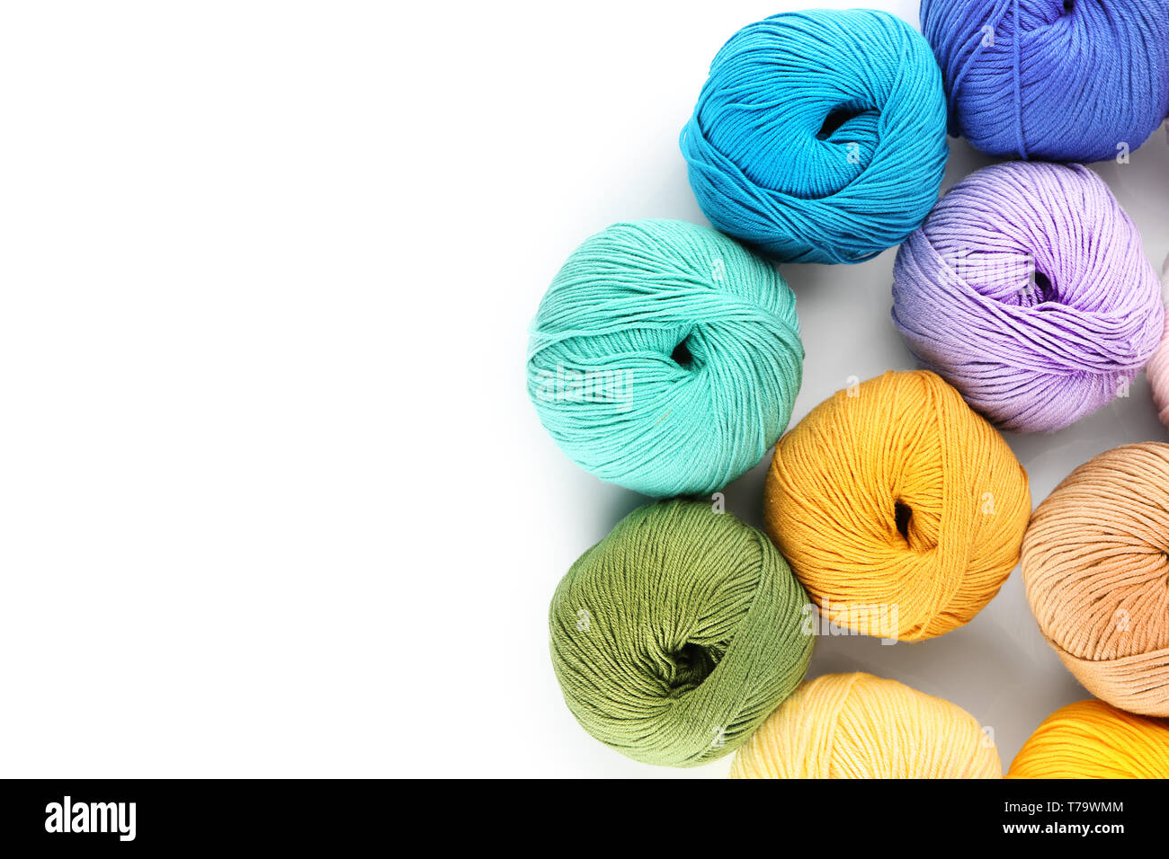 Colorful knitting yarn on white background Stock Photo - Alamy