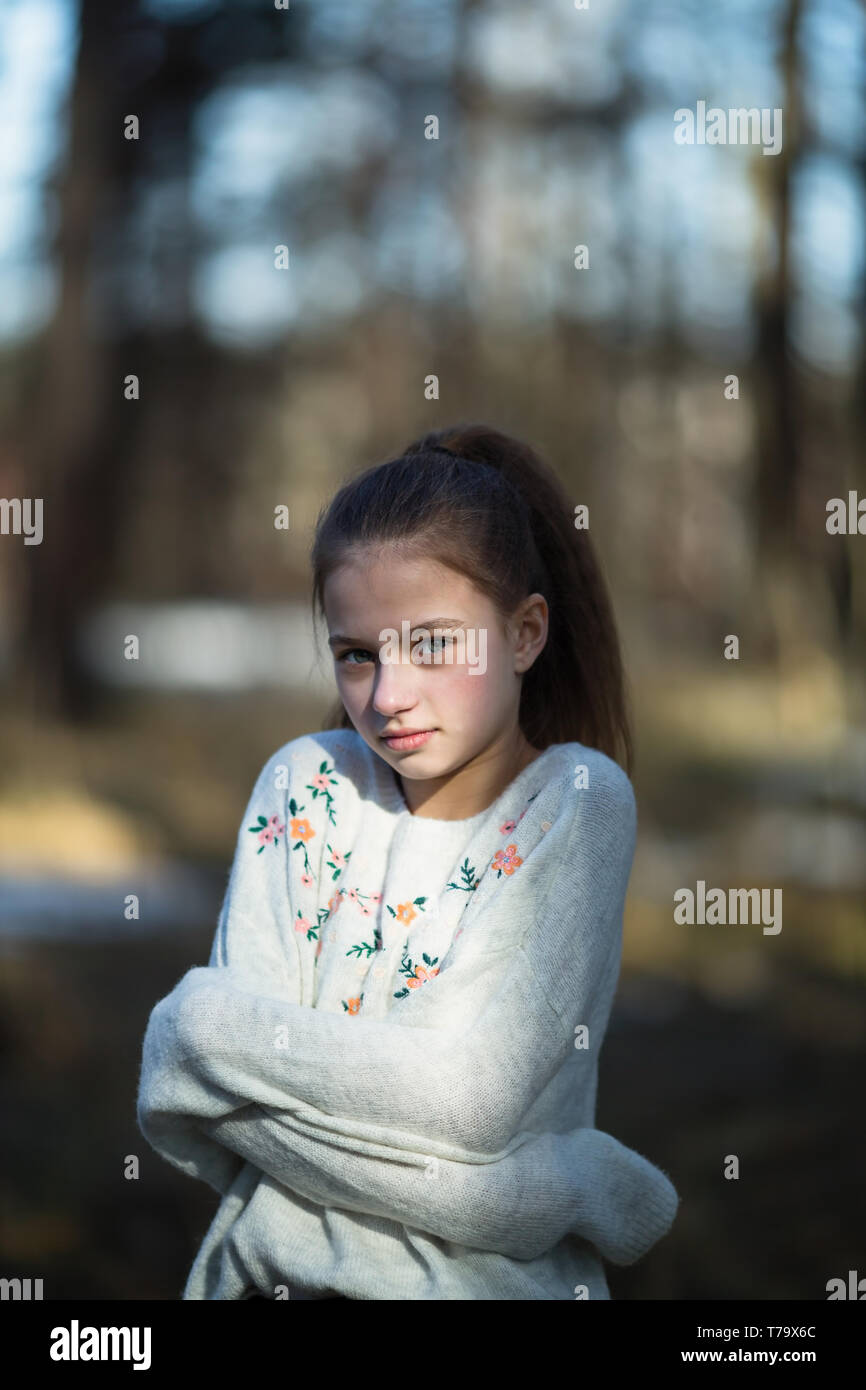 Portrait of cute twelve year old girl in the park Stock Photo - Alamy