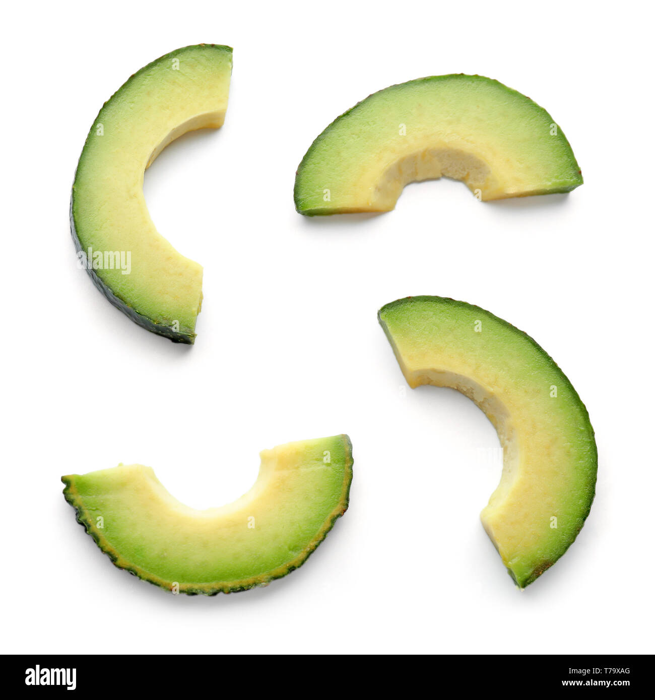 Slices of ripe avocado on white background Stock Photo - Alamy