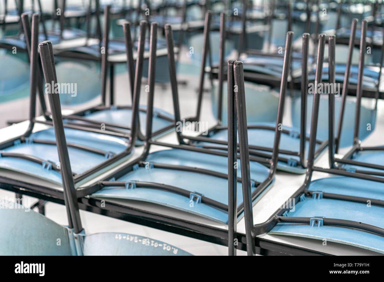 chair on the table in the closed canteen Stock Photo - Alamy