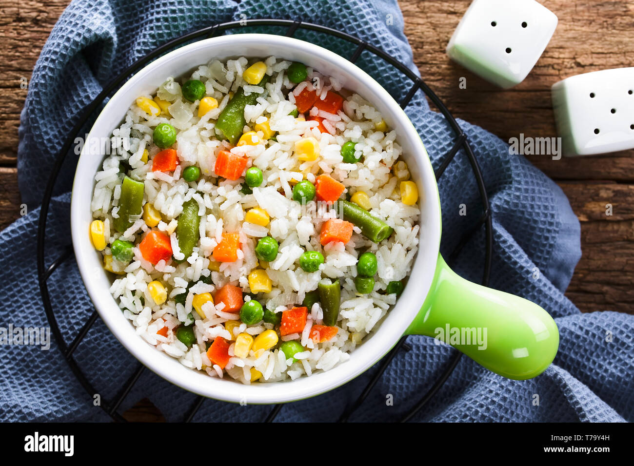 Cooked white rice mixed with colorful vegetables (onion, carrot, green ...