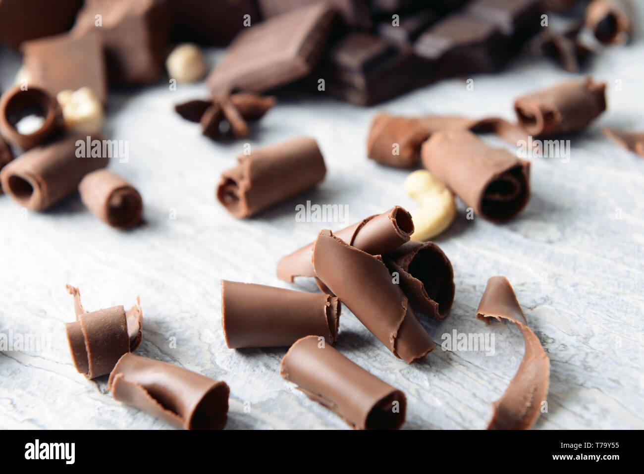Delicious chocolate curls on table Stock Photo - Alamy