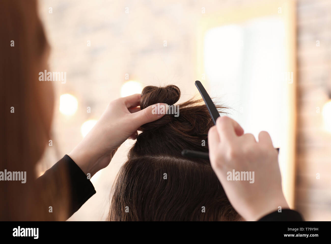 Professional hairdresser working with client in salon Stock Photo - Alamy