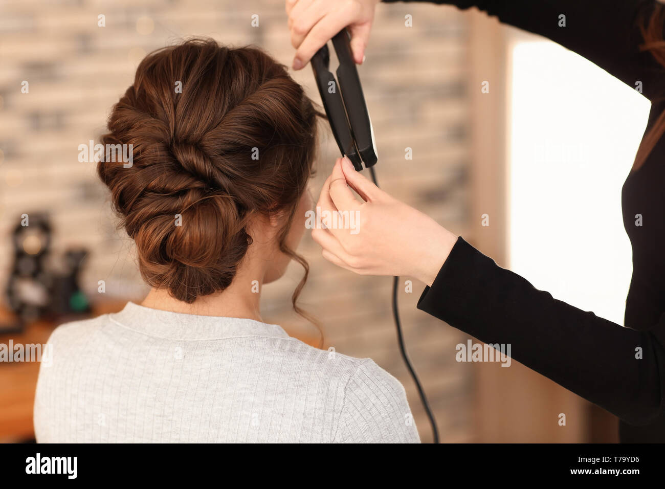 Professional hairdresser working with client in salon Stock Photo - Alamy