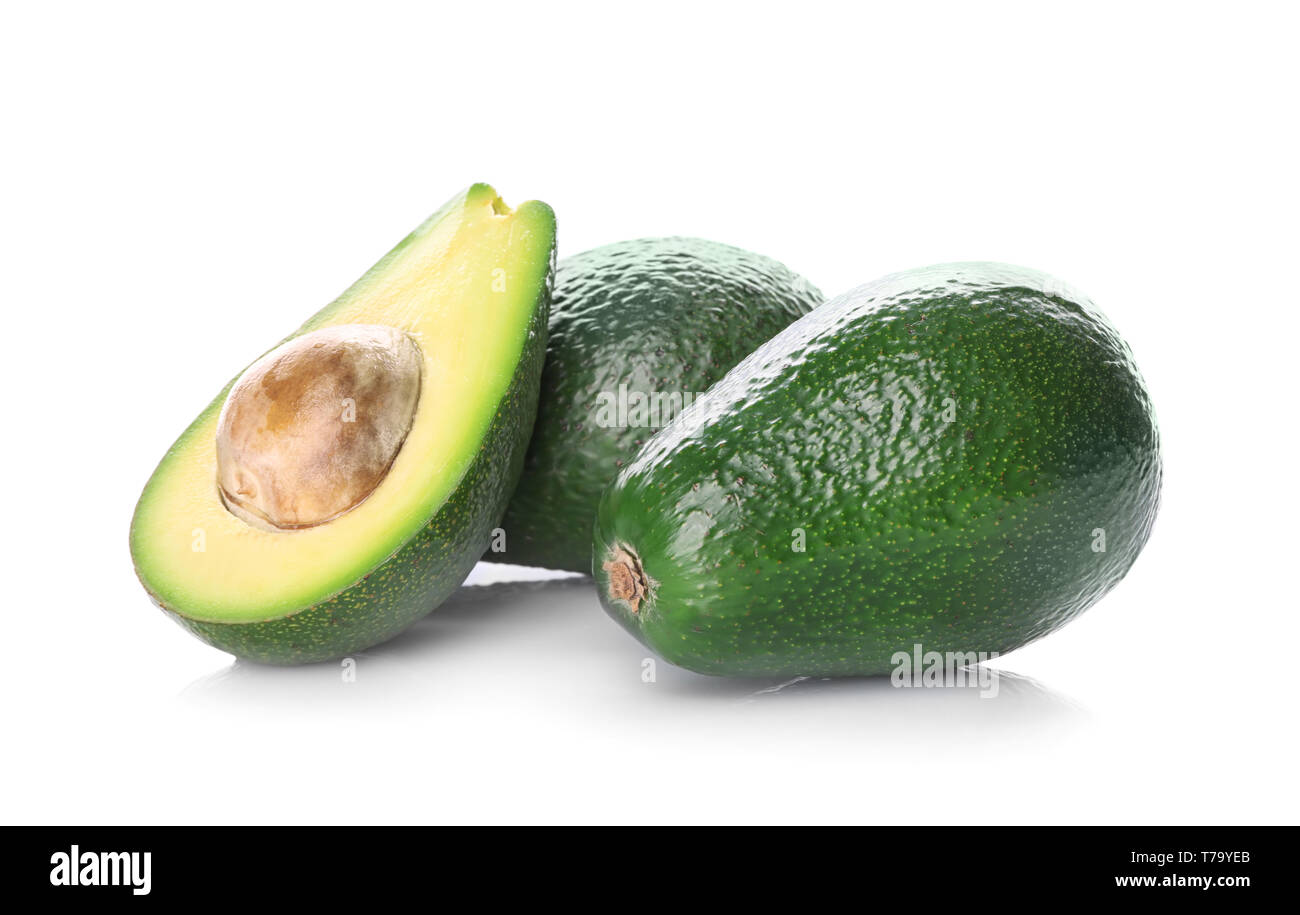 Fresh avocados on white background Stock Photo - Alamy
