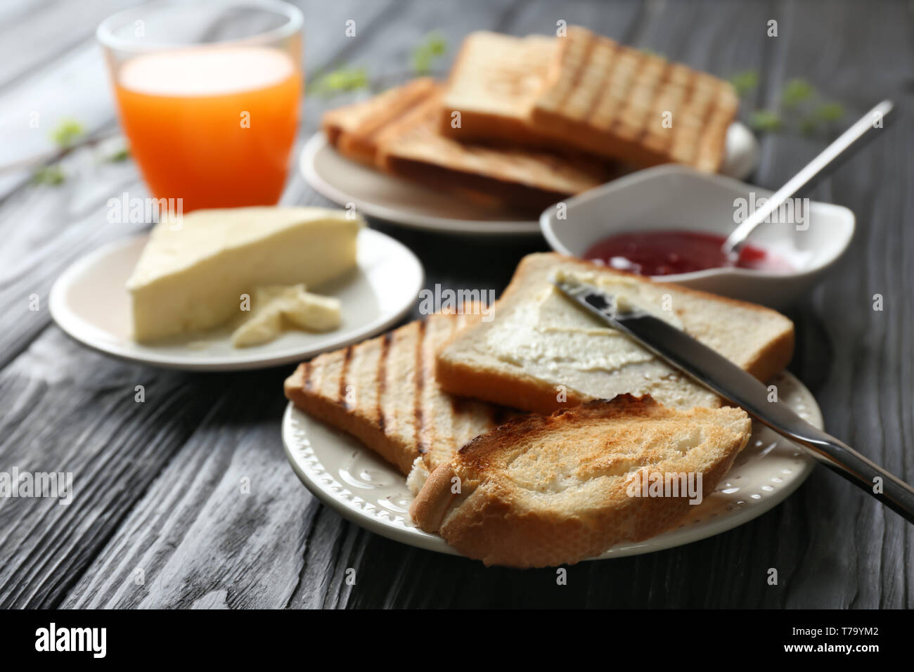 Toasted bread with butter on plate Stock Photo - Alamy