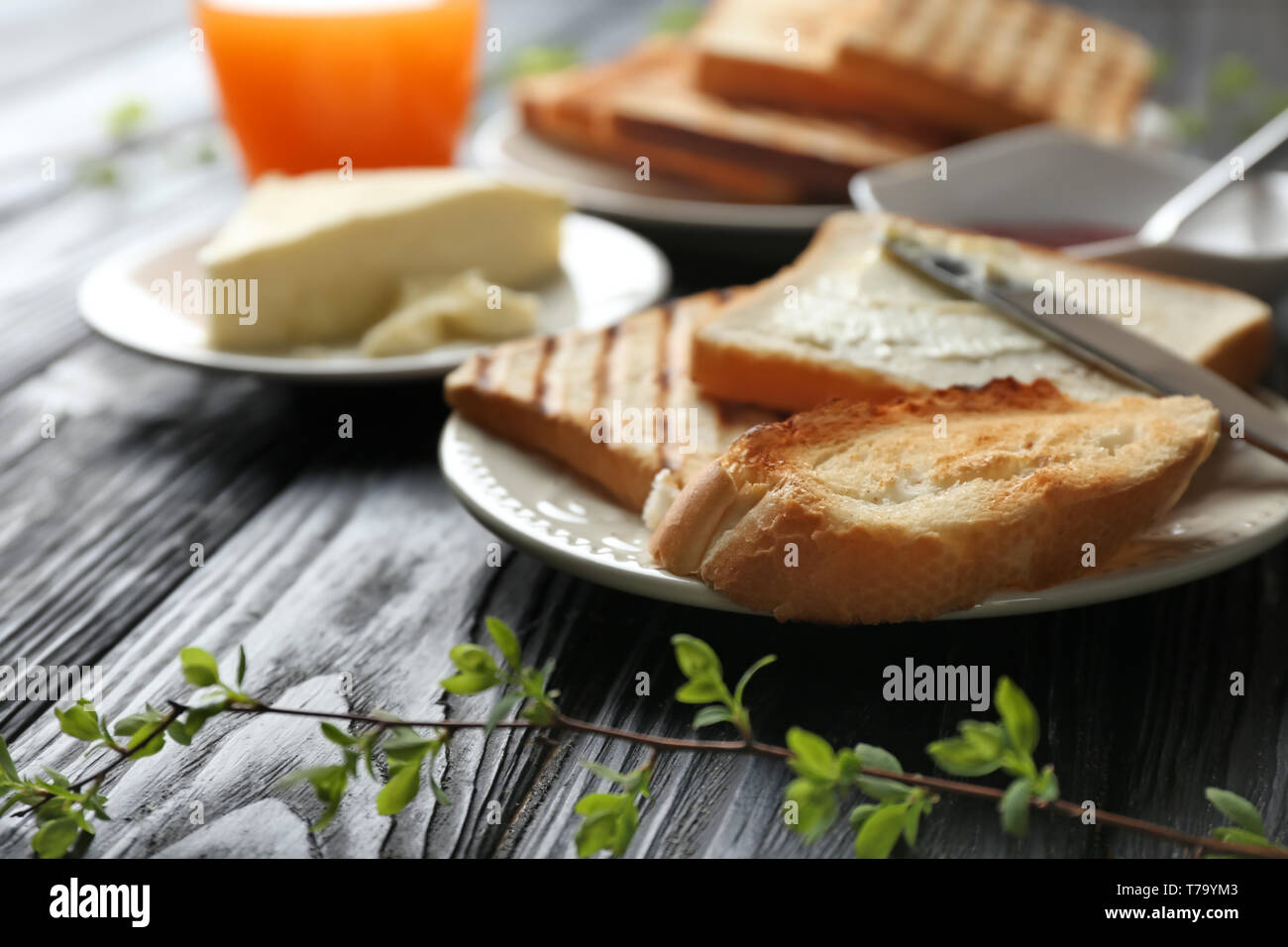 Toasted bread with butter on plate Stock Photo - Alamy