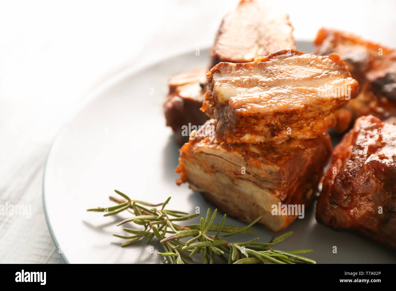 Delicious grilled ribs on plate Stock Photo - Alamy