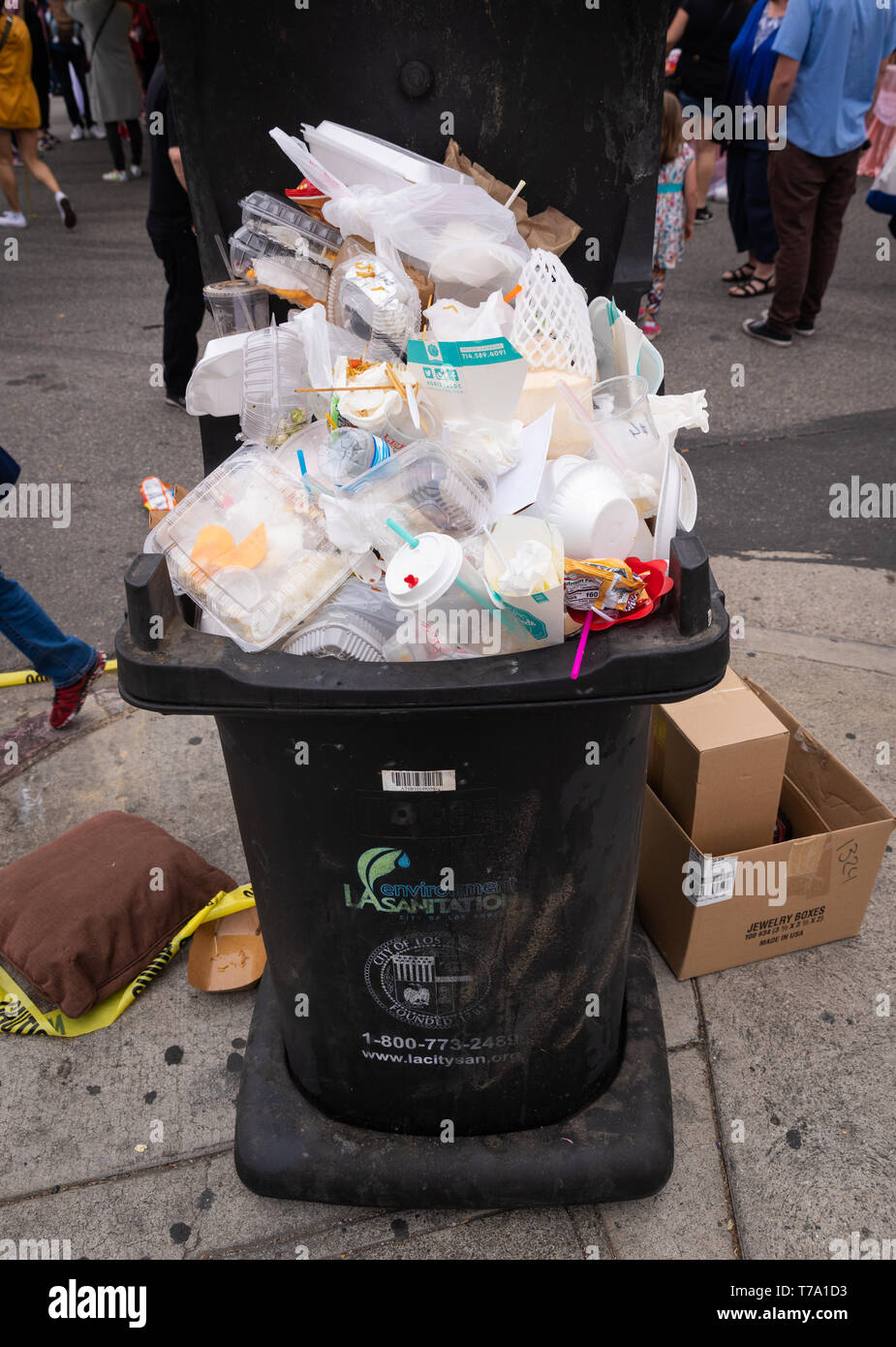 Overflowing trash container with plastic and other refuse Stock Photo ...
