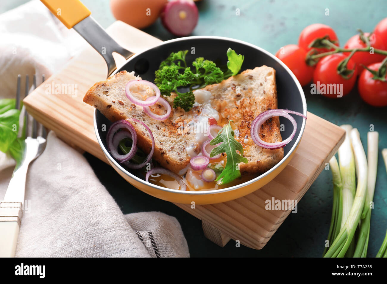 Pan with toasted bread on table Stock Photo - Alamy
