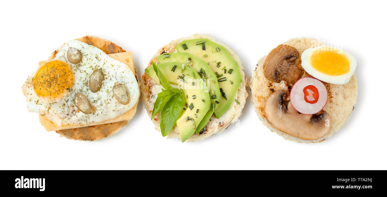 Different delicious toasts on white background Stock Photo - Alamy