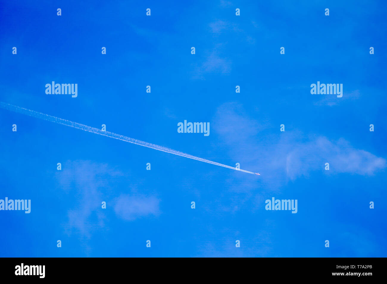 Clearly beautiful blue sky with white line plane Stock Photo - Alamy