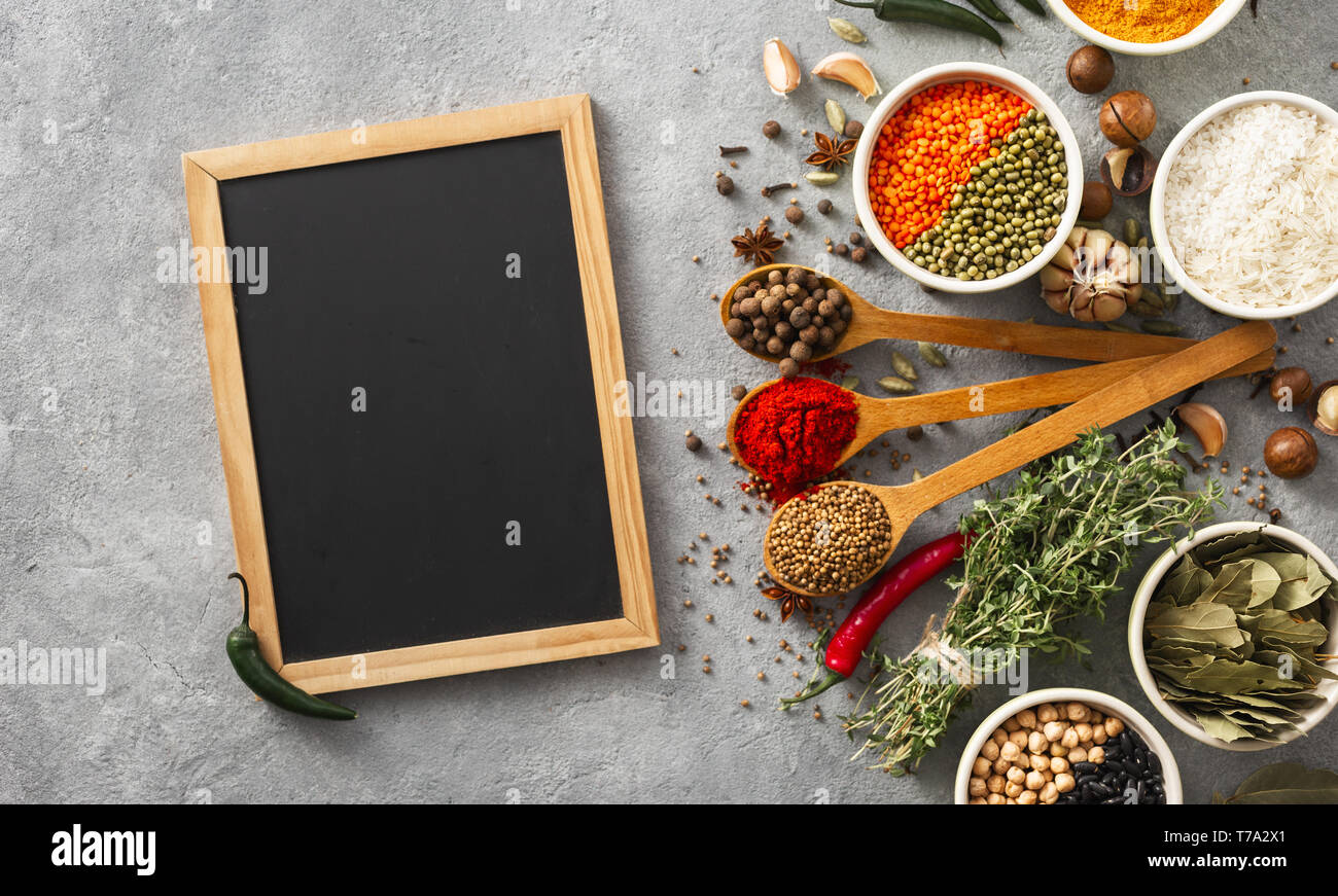 Menu background. Chalkboard with spices and herbs top view with rice ...