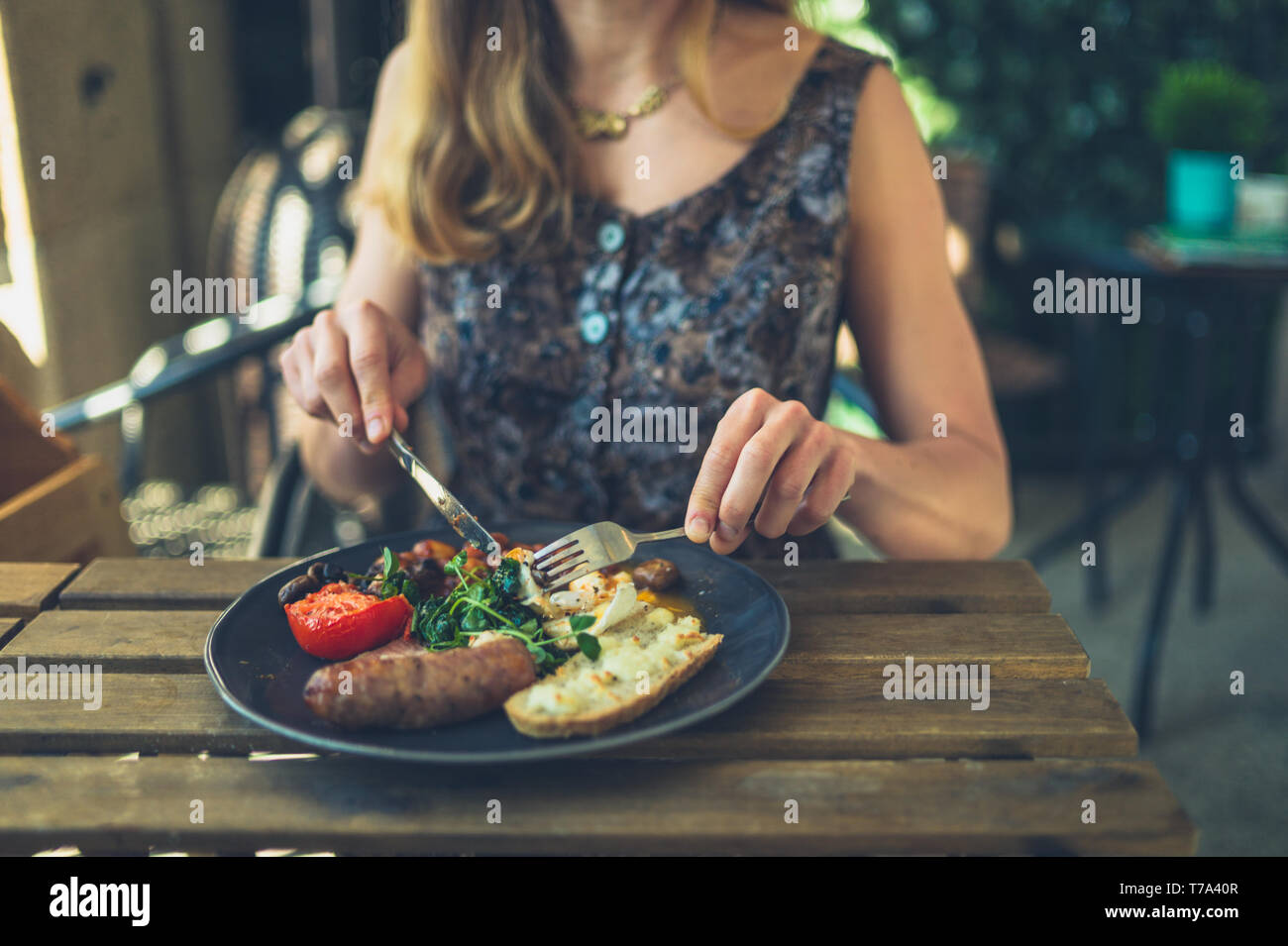 Woman eating sausage hi-res stock photography and images - Alamy