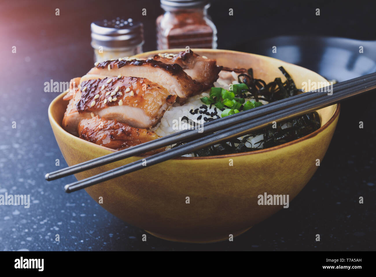 Rice cup with grilled chicken in Japanese style or yakitori don applied ...