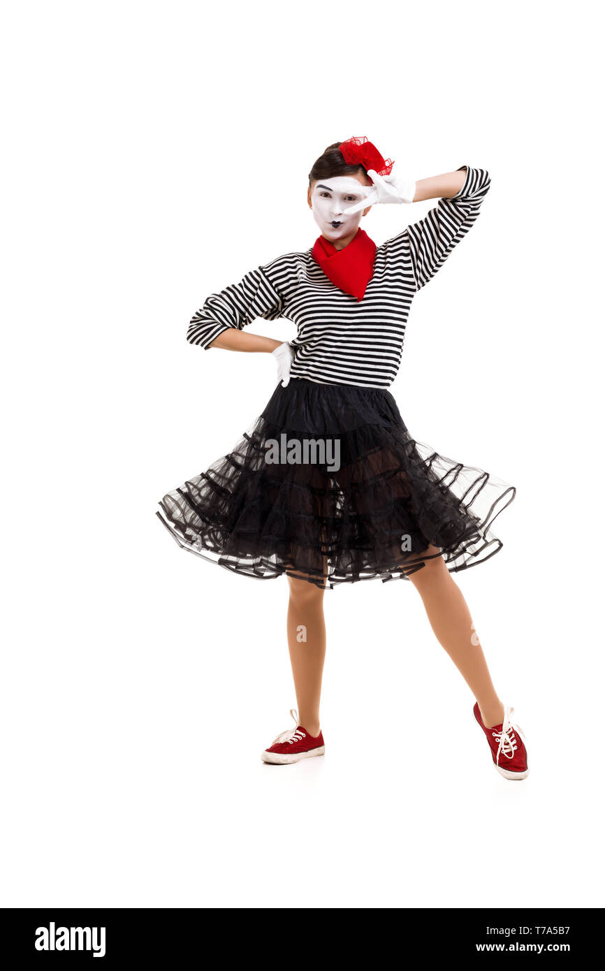 Full length portrait of a mime woman artist looking at camera and ...
