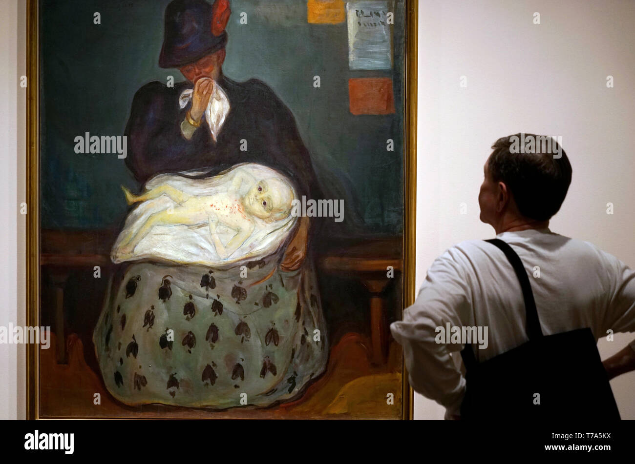 A visitor in front of Inheritance (1897-1899) by Edvard Munch. Munch ...