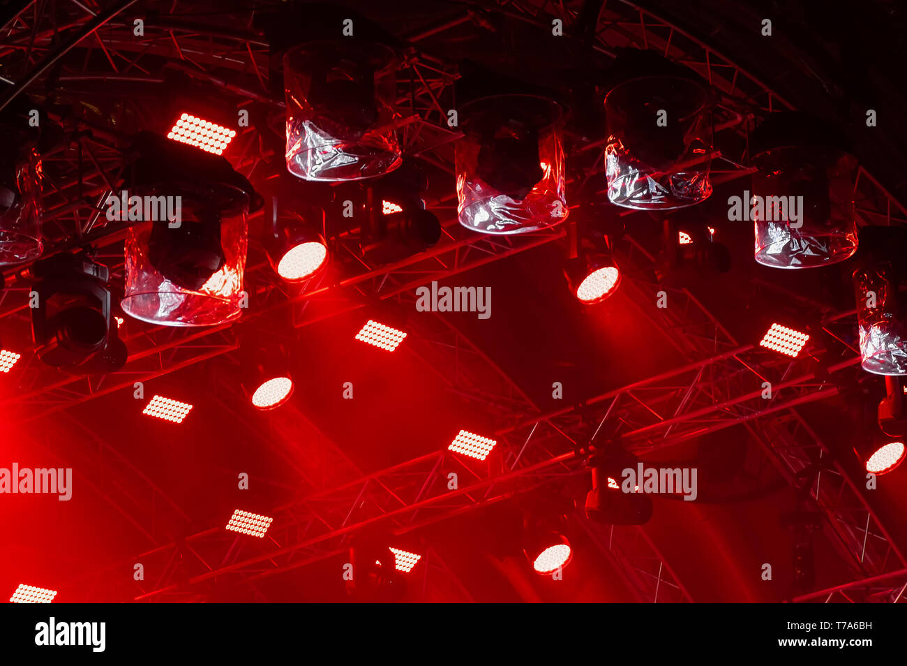 Colorful concert lighting. Red lanterns and spotlights at a concert ...