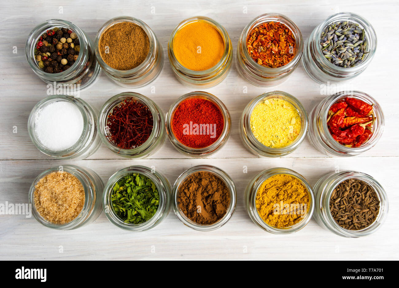 Large collection of spices in small bowls on white Stock Photo - Alamy