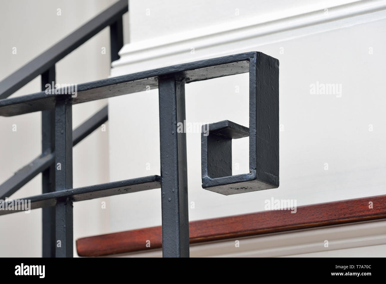 Iron handrail end, detail. Square variation on railing volute return ...