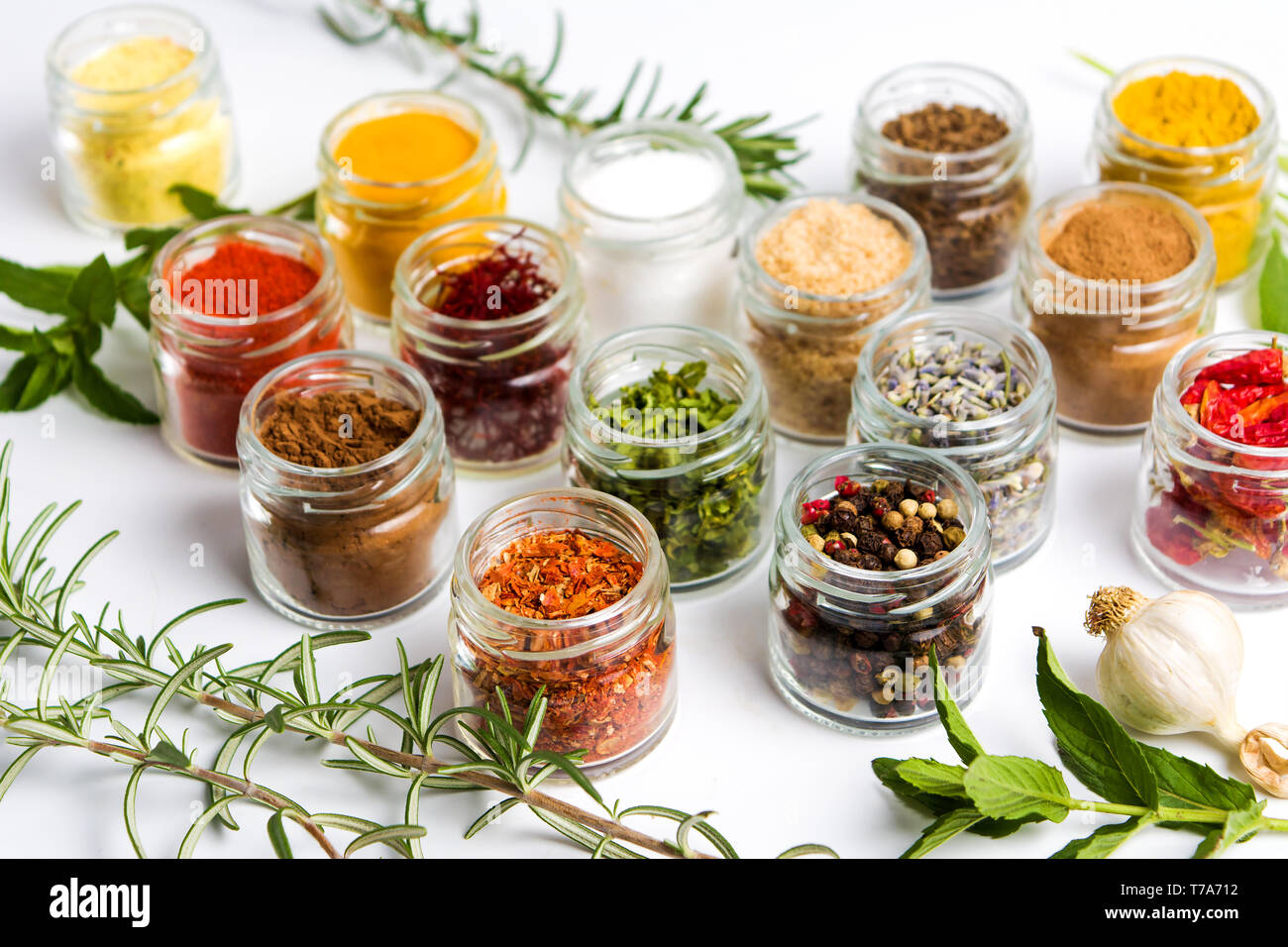 Large collection of spices in small bowls on white Stock Photo - Alamy