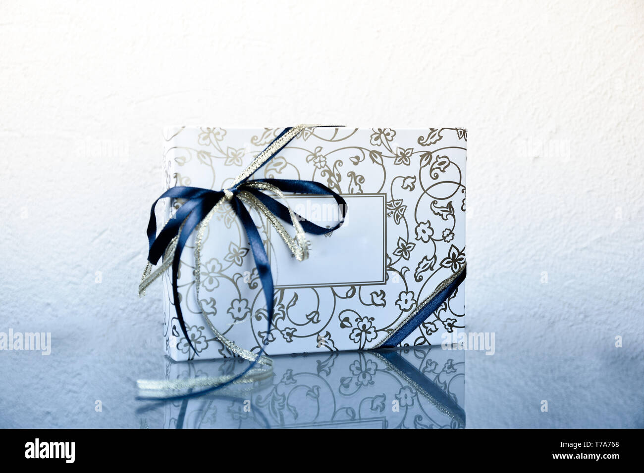 Gift wrapping with blue ribbons on white background Stock Photo - Alamy